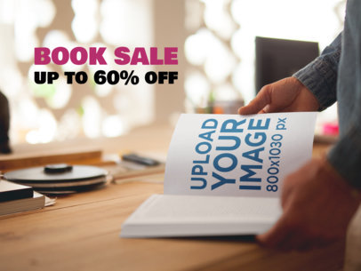 Placeit - eBook Ads - Book Being Read on a Wooden Table