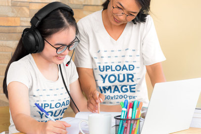 Placeit - T-Shirt Mockup of a Teacher and Her Student Taking a Class