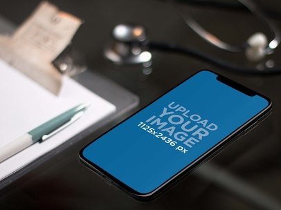 Placeit - White iPhone Mockup Lying on a Doctor's Office Desk