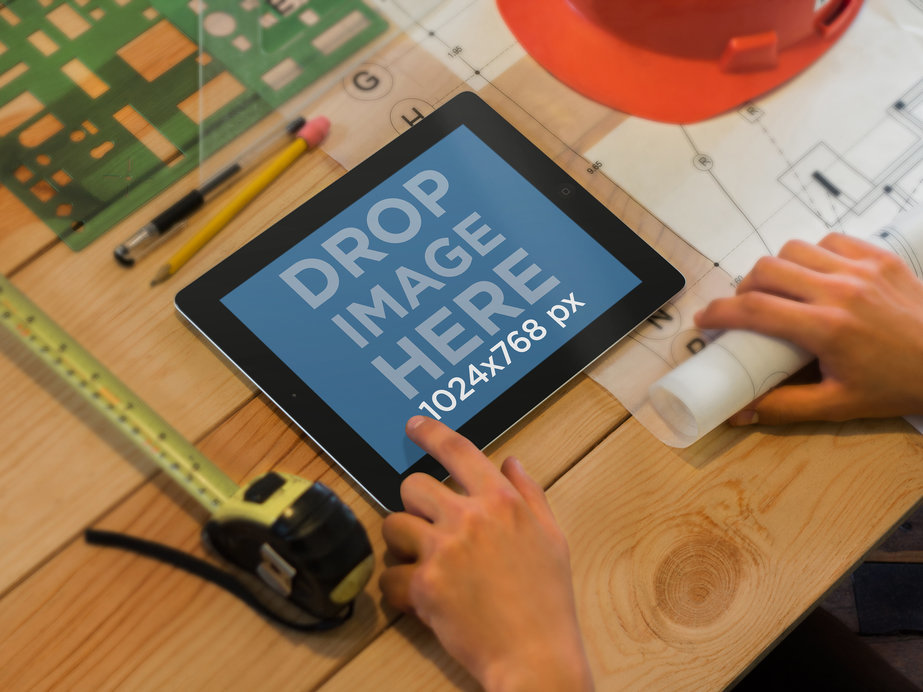 Placeit - Mockup of an iPad Being Used at a Construction Site
