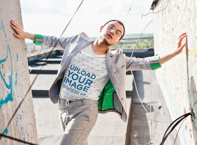 Placeit - Heathered T-Shirt Mockup of a Stylish Man Posing With a Gray Suit