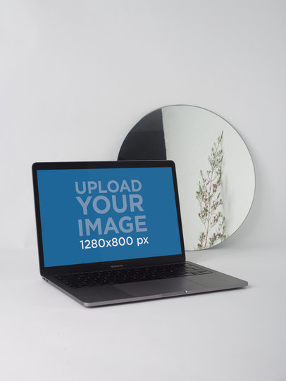 Placeit - MacBook Pro Mockup on the Bed Near a Window