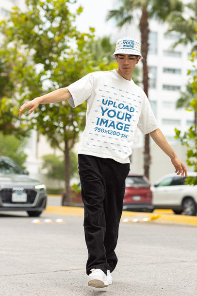 Placeit - Round-Neck T-Shirt Mockup of a Man Wearing a Bucket Hat