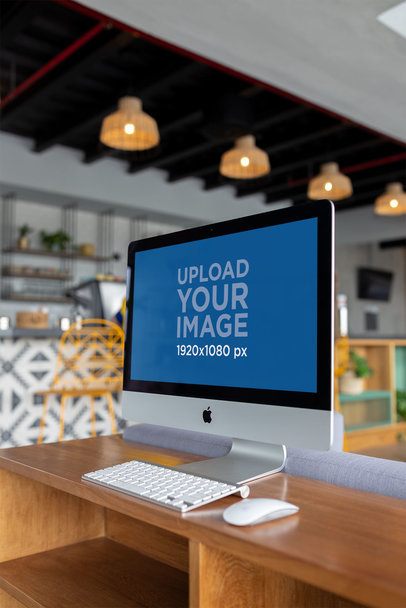 Placeit - iMac Mockup Standing on a Recycled Compressed Wooden Desk