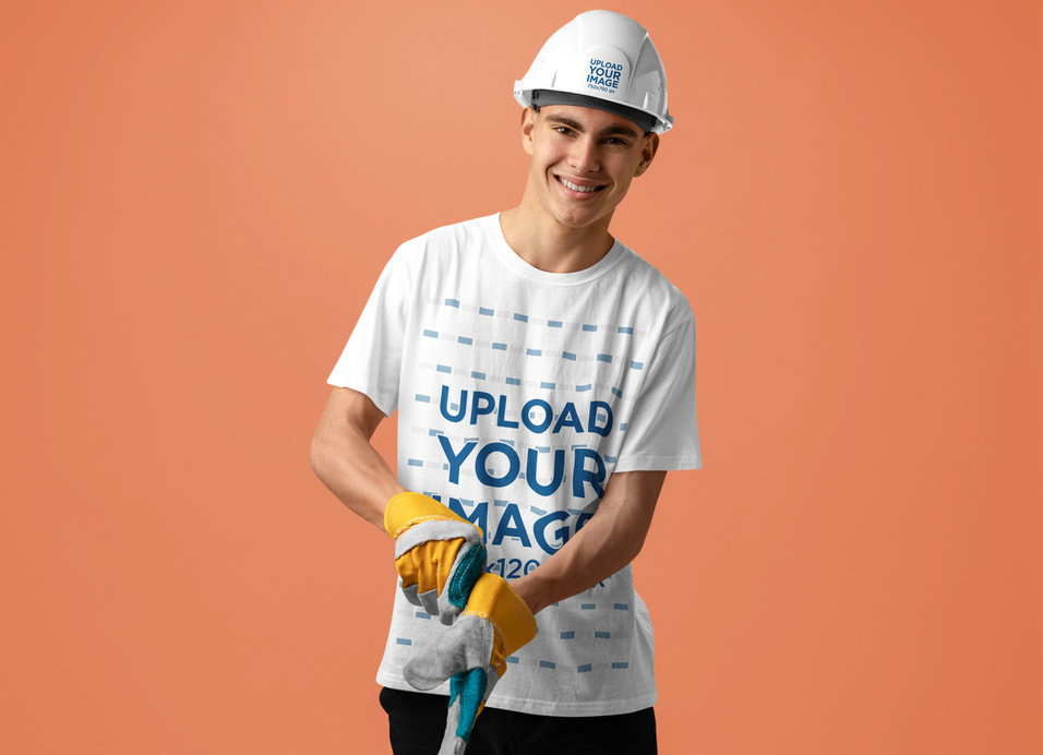 Placeit - Mockup of a Young Worker Wearing a T-Shirt and a Hard Hat