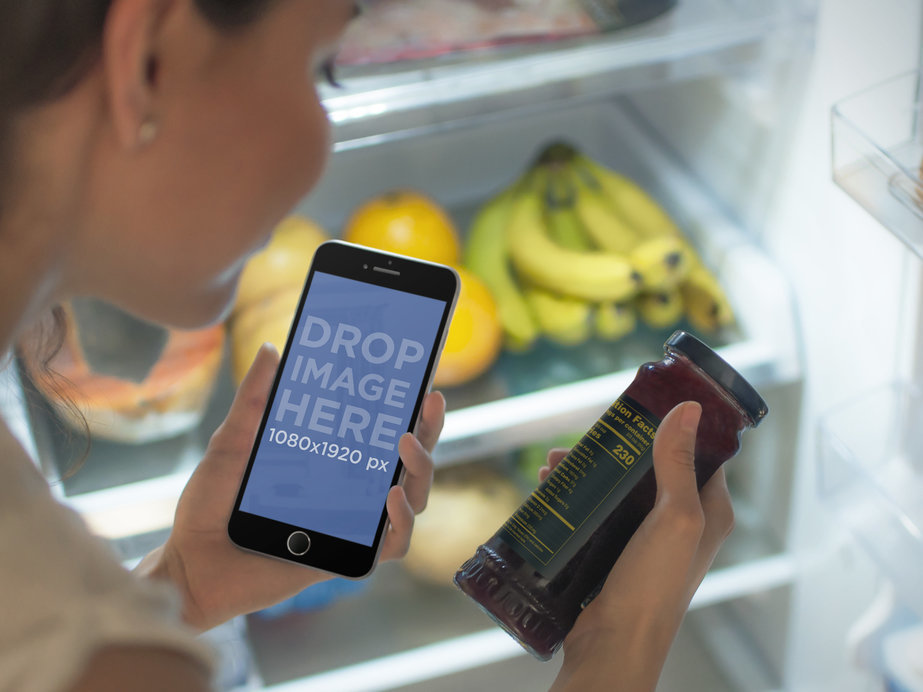 Placeit - IPhone 6 Mockup of Woman With Open Fridge Looking at ...
