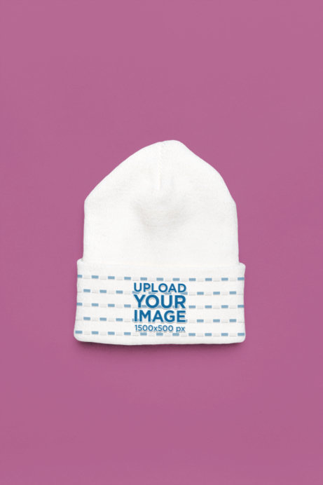 Placeit - Mockup of a Yupoong Beanie Lying on a Colorful Setting