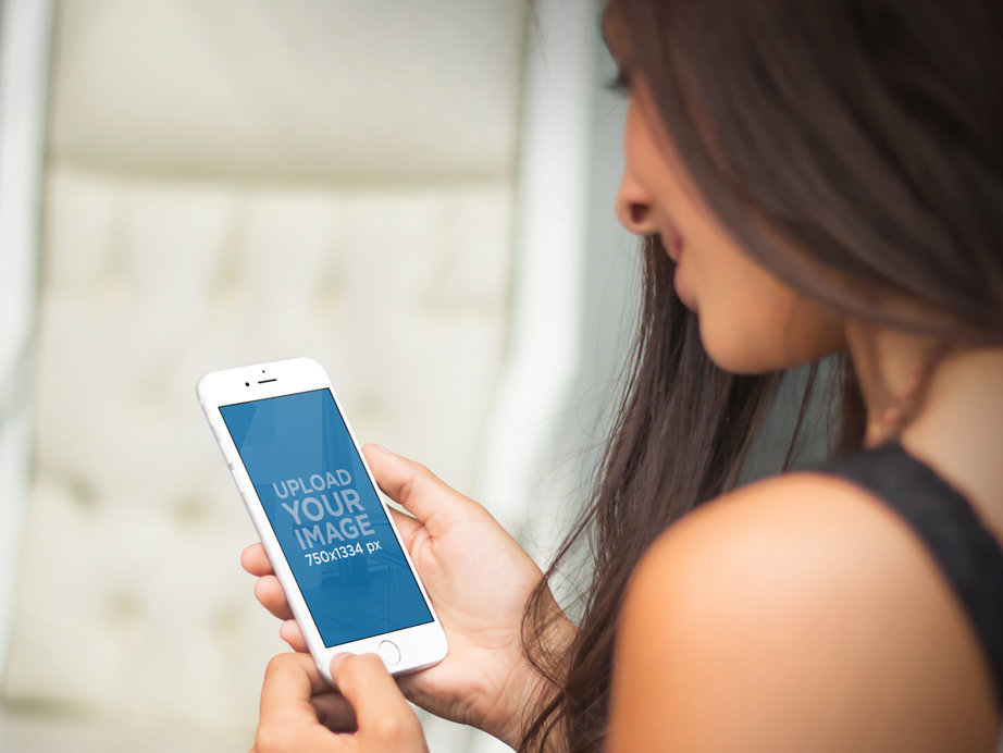 Placeit - Mockup of a Lady Using her White iPhone 7 at Home