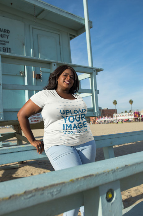 Placeit - Mockup of a Woman Wearing a Plus Size T-Shirt Leaning on a ...