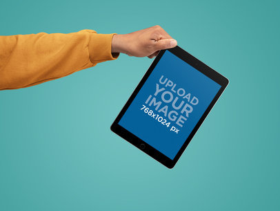 Placeit - iPad Mockup Being Held Against a Solid Color Background