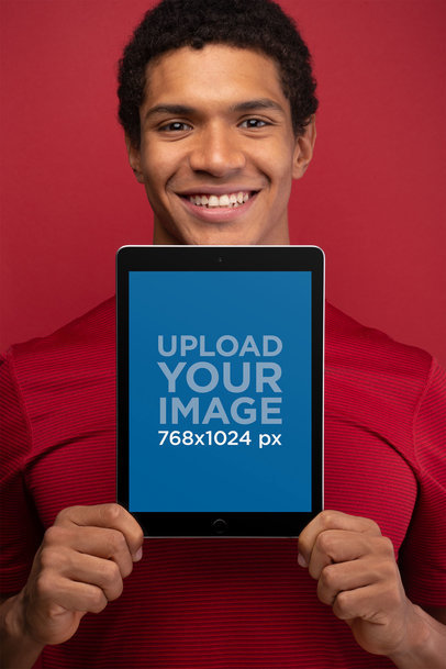 Placeit - iPad Mockup Being Held Against a Solid Color Background