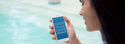 Placeit - iPhone Mockup Featuring a Pretty Woman by the Pool