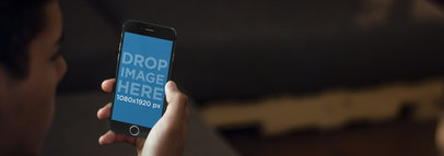 Placeit - Mockup of a Man Using an iPhone 6 at a Recording Studio