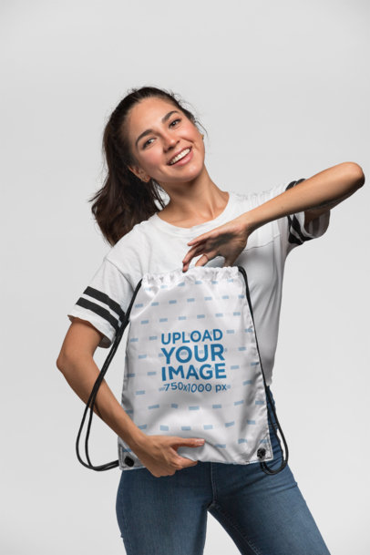 Placeit - Mockup of a Woman Looking Inside a Drawstring Bag