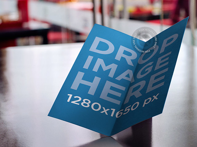 Placeit - Brochure Mockup Featuring a Brochure Sitting on Top of a Table