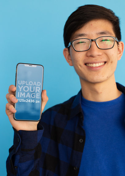 Placeit - iPhone 11 Pro Mockup of a Smiling Man with Glasses