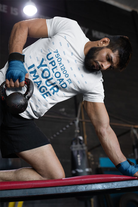 Placeit - Tee Mockup of a Muscular Man Training at the Gym