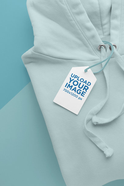 Placeit - Brand Tag Mockup Featuring a Hoodie Placed on a Customizable ...