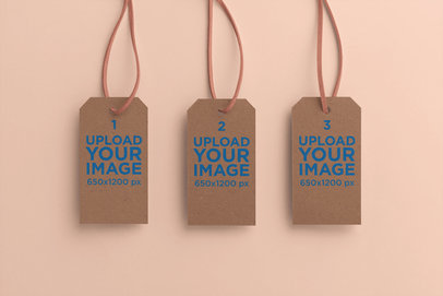Placeit - Mockup of Three Brand Tags on a Plain Surface