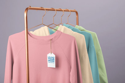 Placeit - Mockup of a Cardboard Clothing Tag Lying on a Sweater over a ...