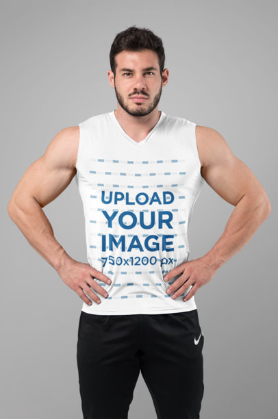 Placeit - Mockup of a Man in a Sleeveless Shirt Showing off His Muscles