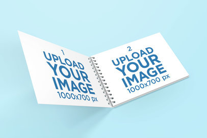 Placeit - Mockup Featuring a Spiral Notebook Standing Against a Plain ...