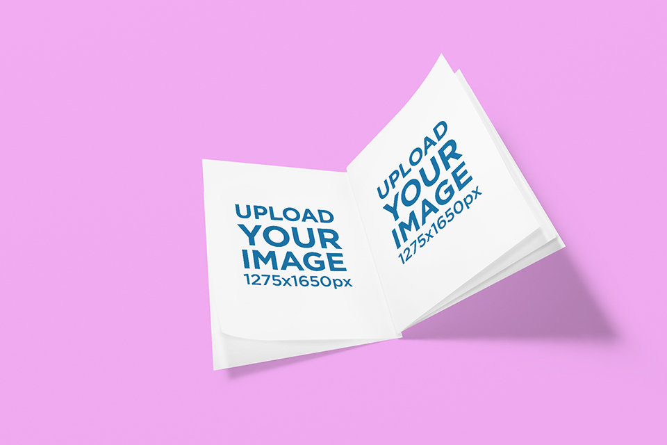 Placeit - Mockup of an Open Booklet Placed on a Customizable Background