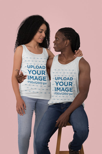 Placeit - Mockup of a Smiling Couple Wearing Tank Tops in a Studio
