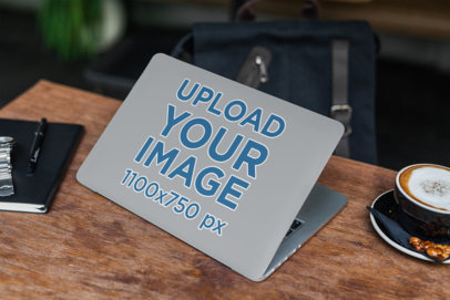Placeit - Mockup of an Angled Laptop Cover Against a Solid Color Surface