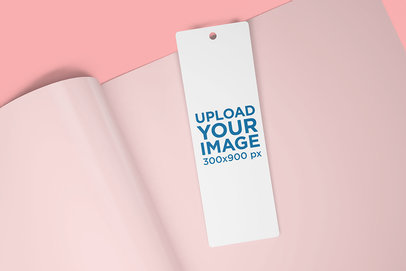 Placeit - Mockup of a Bookmark on Top of a Color-Custom Book
