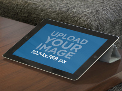 Placeit - Mockup of an iPad in Landscape Position on a Wooden Table