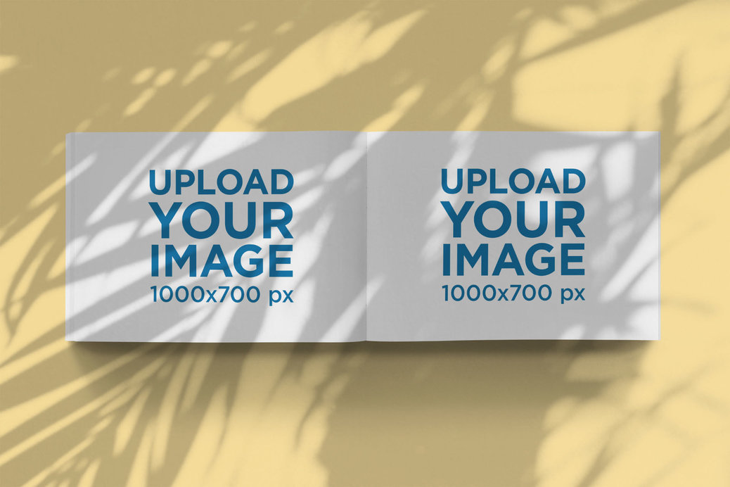 Placeit - Mockup of an Open Horizontal Magazine