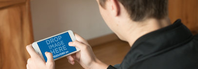 Placeit - Young Boy Playing with his iPhone 7 Plus in Landscape ...