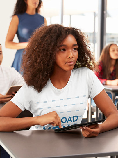 Placeit - T-Shirt Mockup of a Smiling Student Posing by Some Lockers