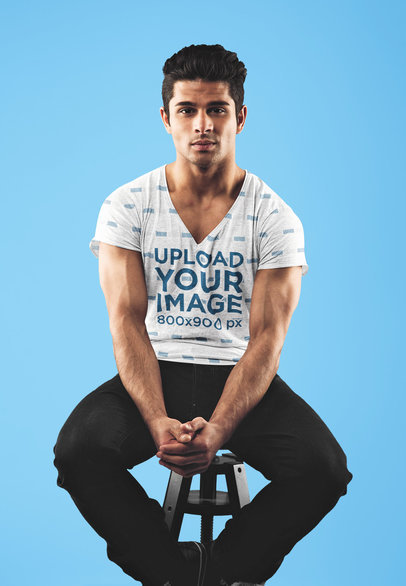 Placeit - T-Shirt Mockup of a Muscular Man Standing at a Studio