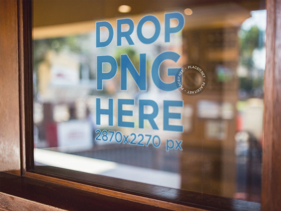 Placeit - Angled Mockup of a Window Decal Surrounded by a Brown Wooden ...