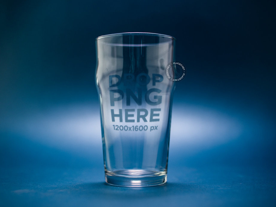 Placeit - Mockup of an Empty Nonic Pint Beer Glass Against a Dark Blue ...