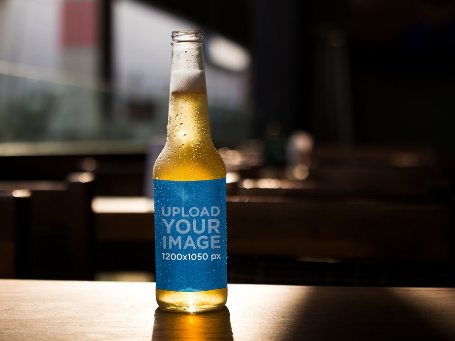 Placeit - Open Gold Lager Beer Bottle Template on a Wooden Surface