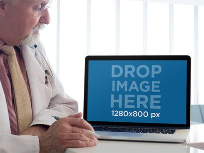 Placeit - MacBook Mockup of a Senior Doctor at a Hospital
