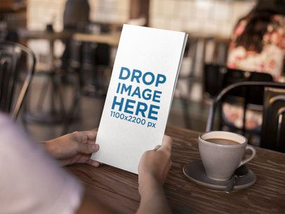 Placeit - Young Woman Reading a Restaurant Menu While Sitting Down Template