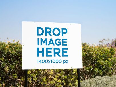Placeit - Mockup of a Real Estate Lawn Sign in the Front Yard of a House